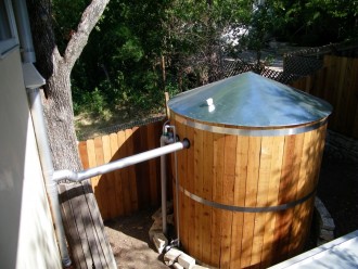 Wood wrapped or clad cisterns for aesthetic installations
